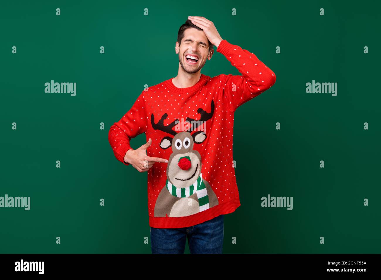 Photo portrait smiling man pointing at funny knitted sweater with ...