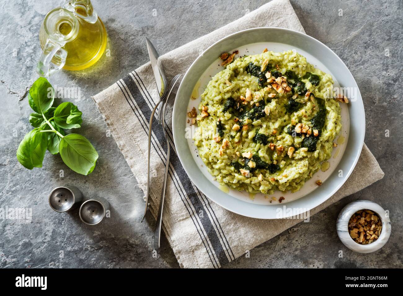 Vegan green risotto with zucchini cream and walnuts Stock Photo - Alamy