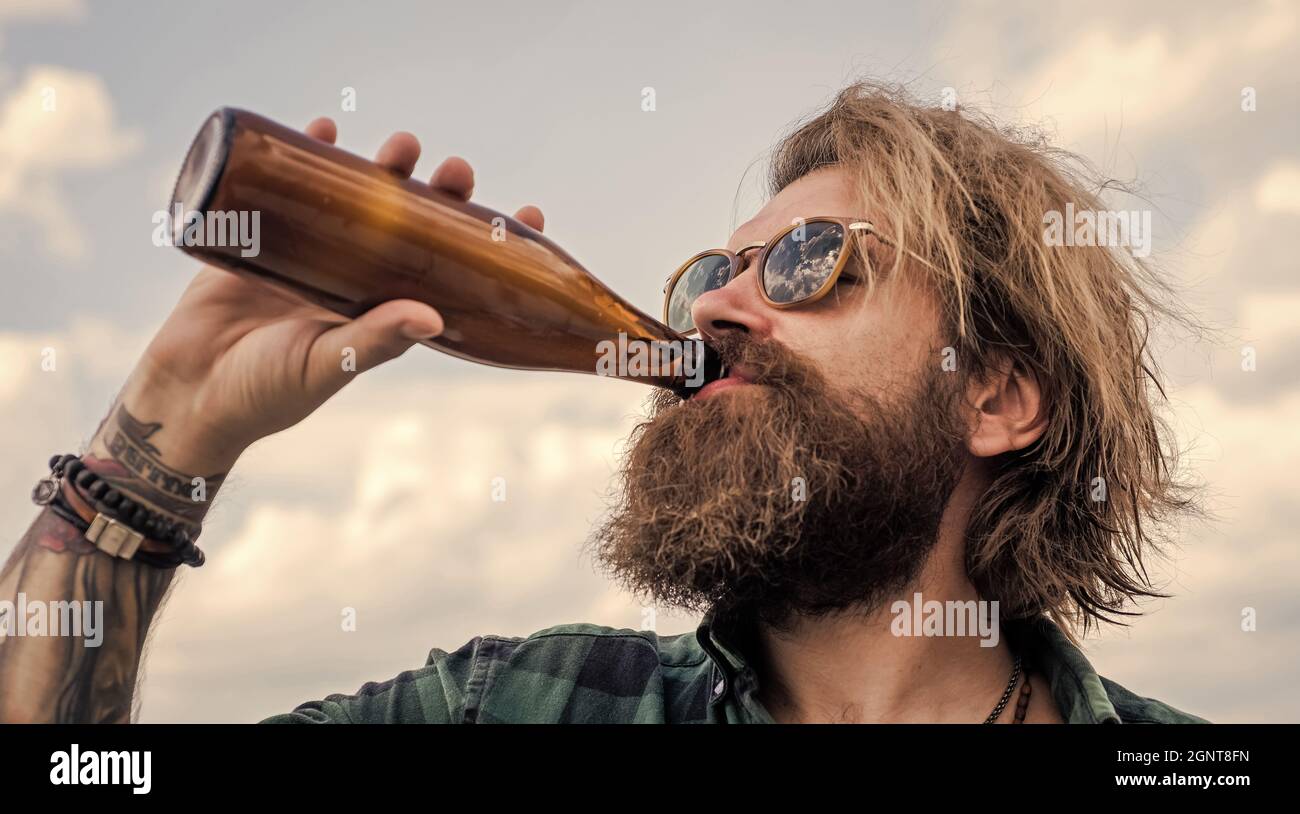 get refreshed and relaxed. mature charismatic male drink beer from ...