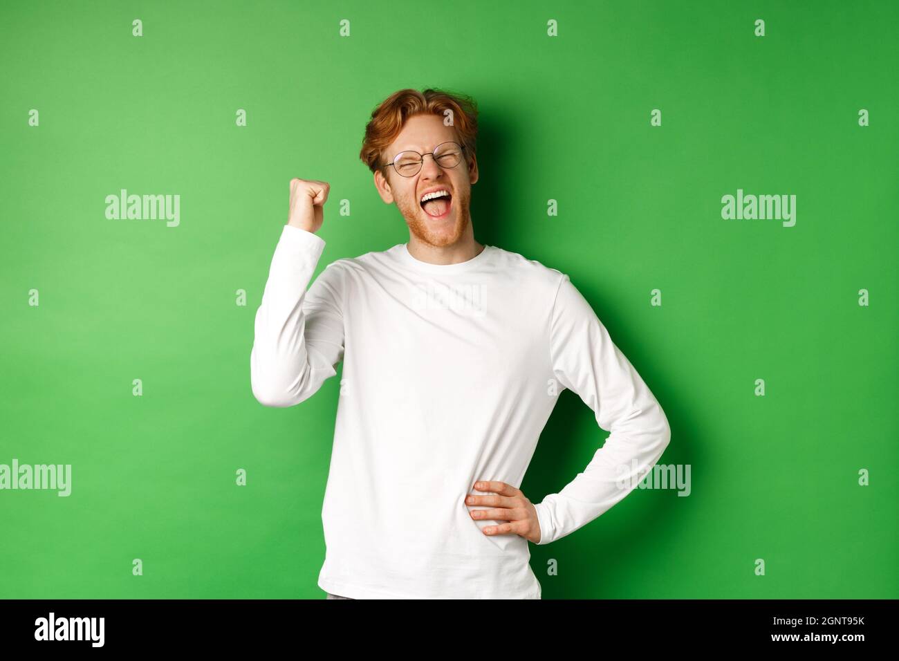 Young cheerful guy scream of joy, winning prize and celebrating, making ...