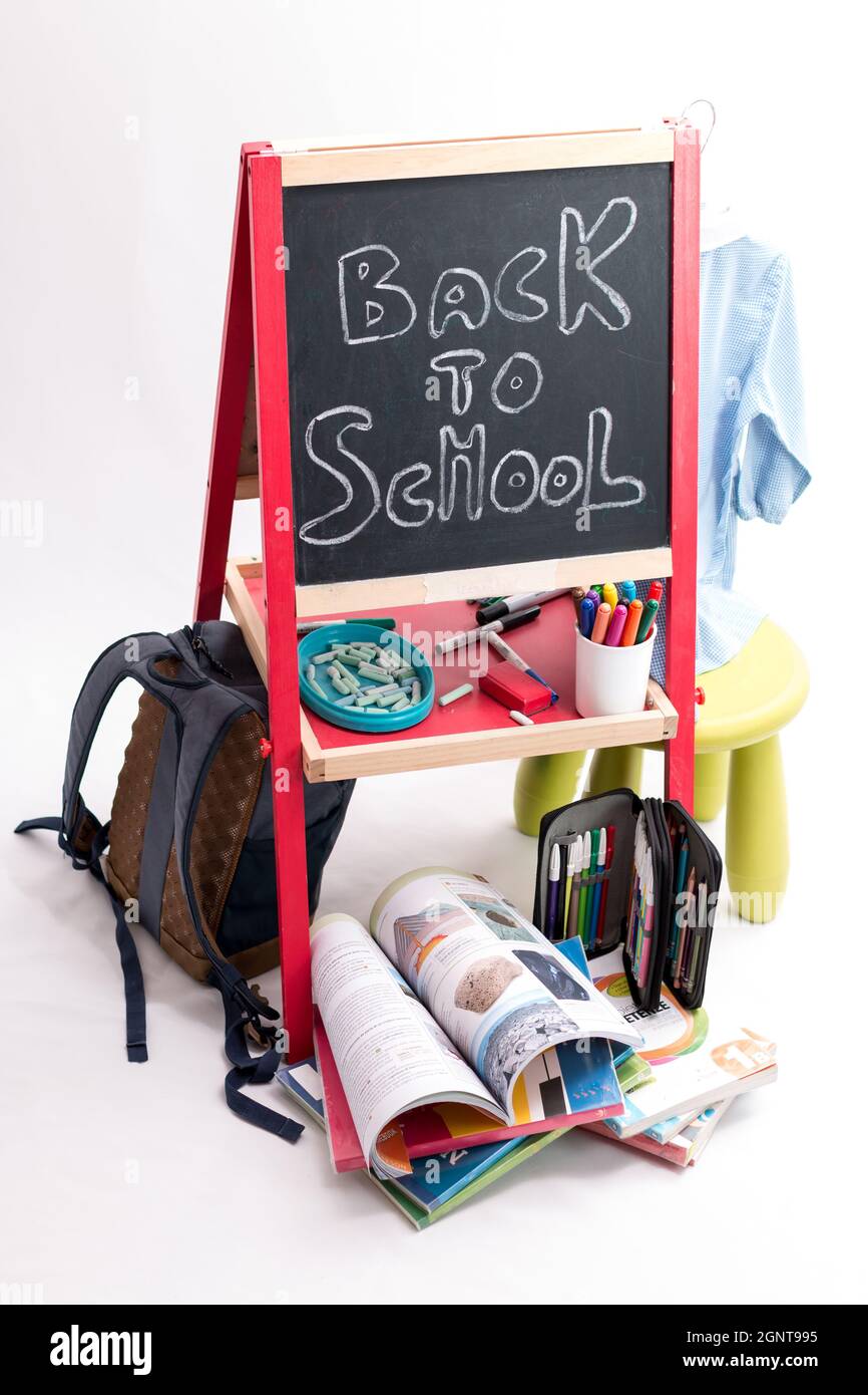 Back to school background - chalkboard, backpack and school items ...