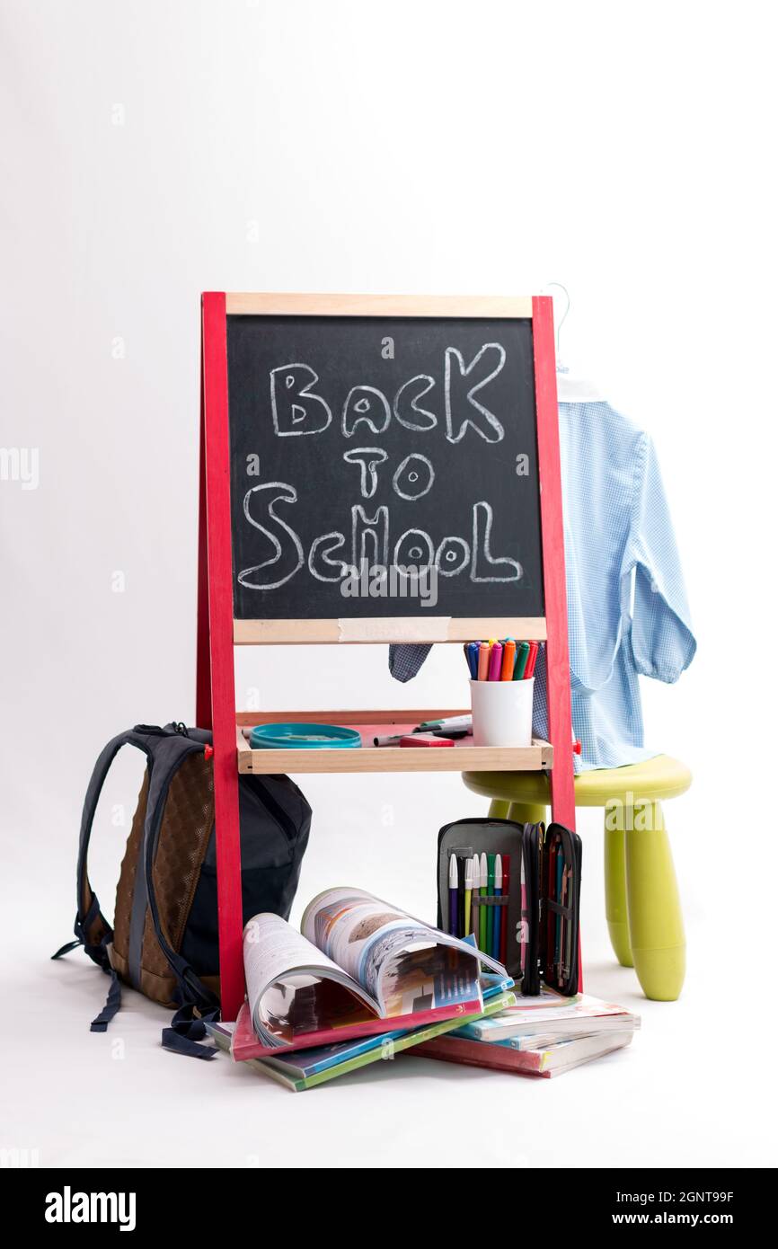 Back to school background - chalkboard, backpack and school items ...