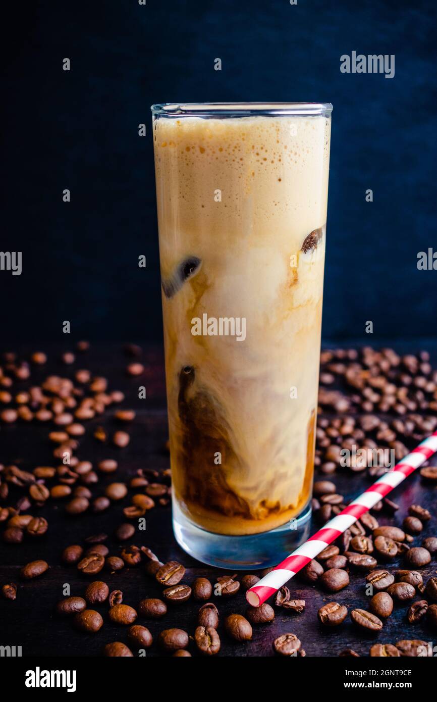 Iced Irish Coffee with Coffee Ice Cubes and Paper Straws: Tall glass of ...