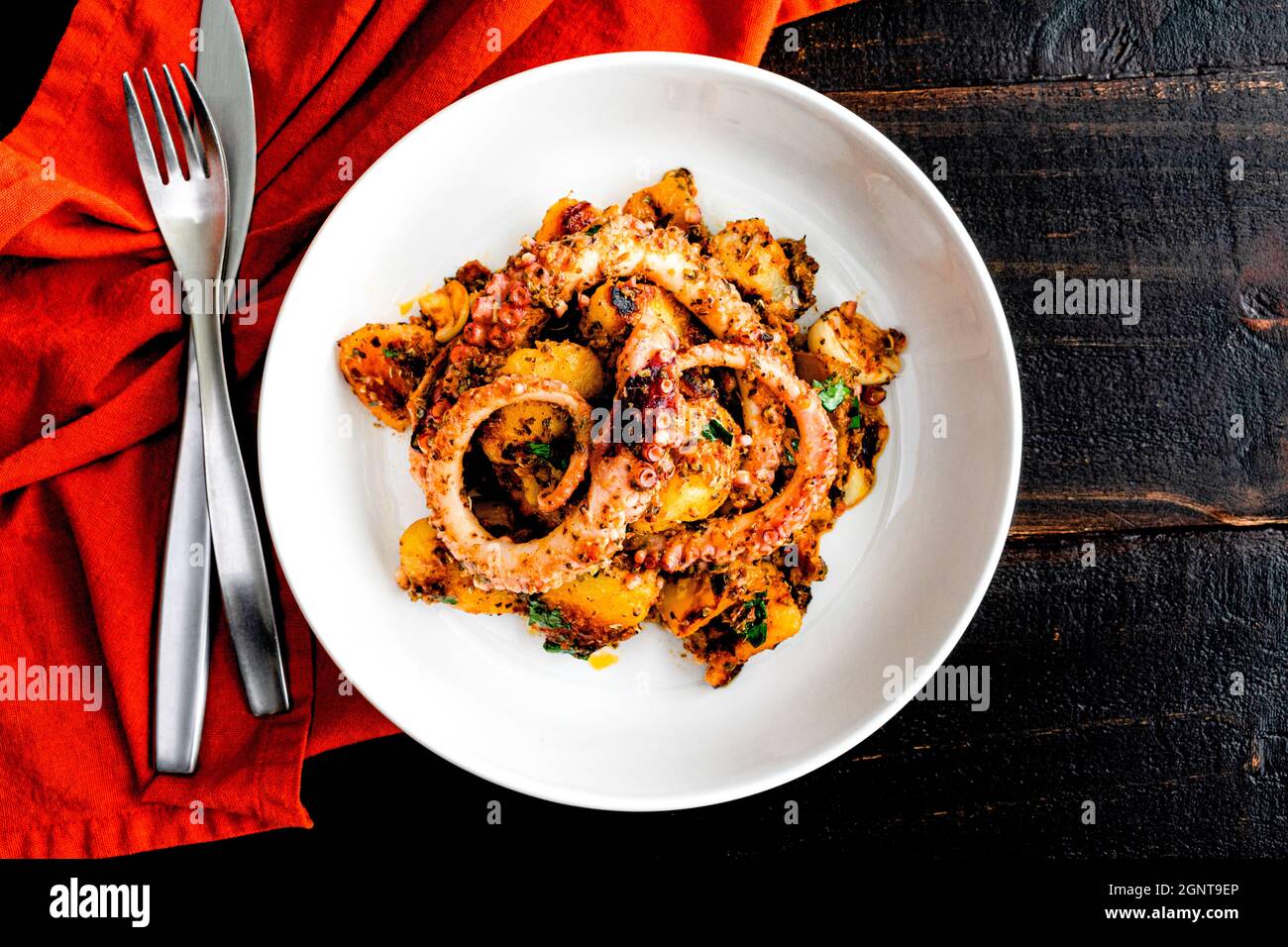 Spanish Style Octopus with Potatoes: Tender octopus served with browned ...