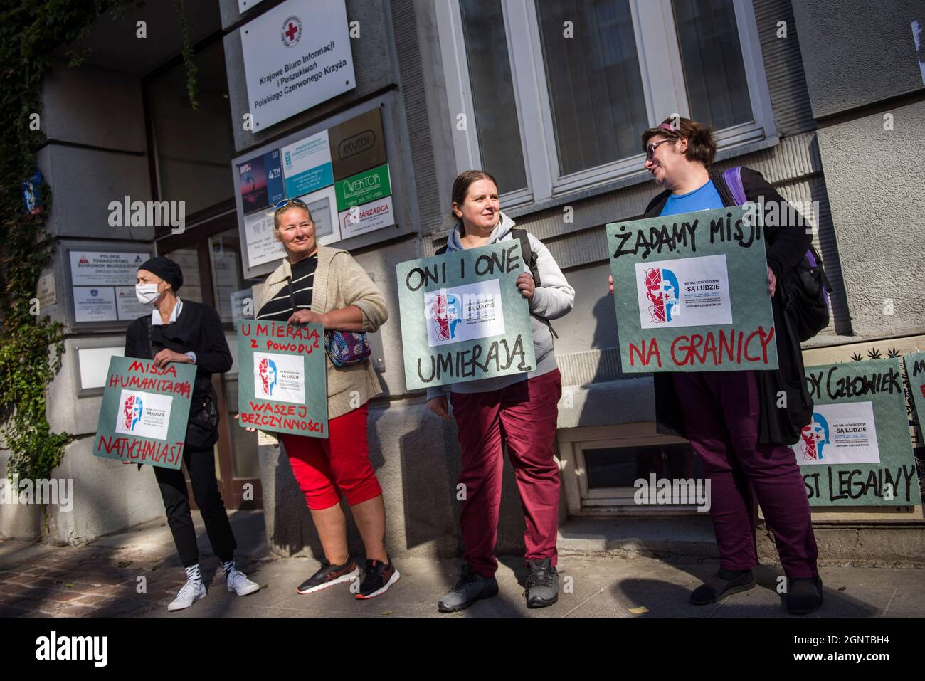 Warsaw, Poland. 27th Sep, 2021. Activists hold placards at the entrance ...