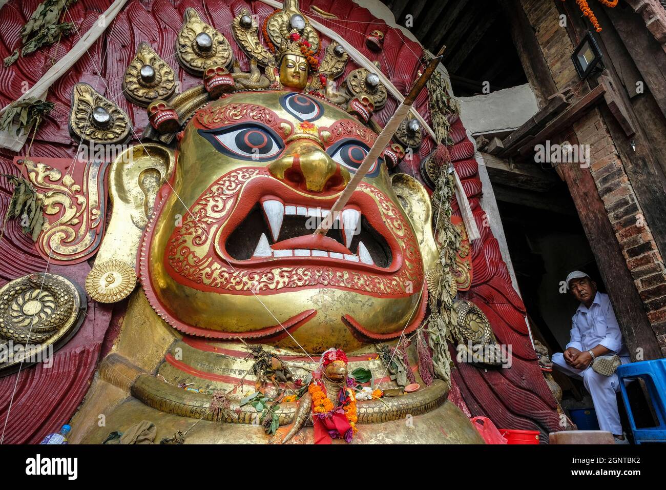 Kathmandu, Nepal - September 2021: A man sitting next to the Seto ...