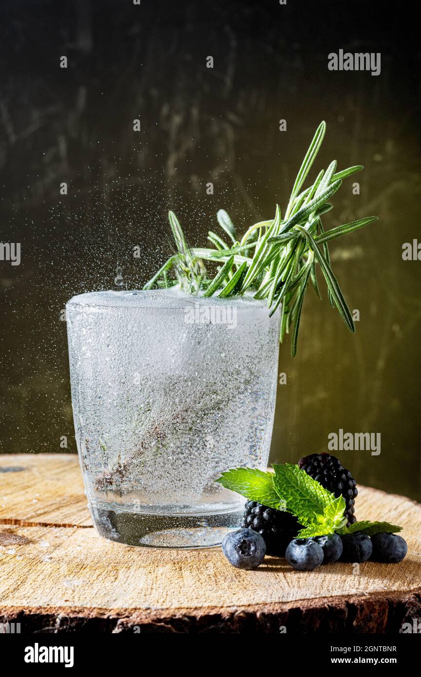 Sweet sparkling water. Flying gas above the glass. Carbonated drink ...