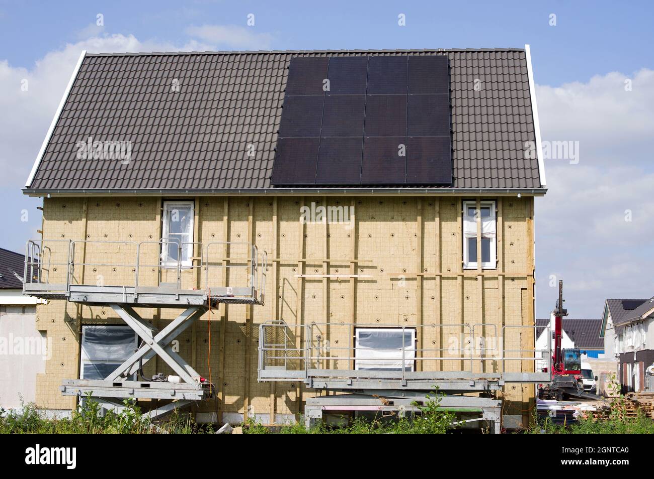 New building facade with solar panels hi-res stock photography and ...