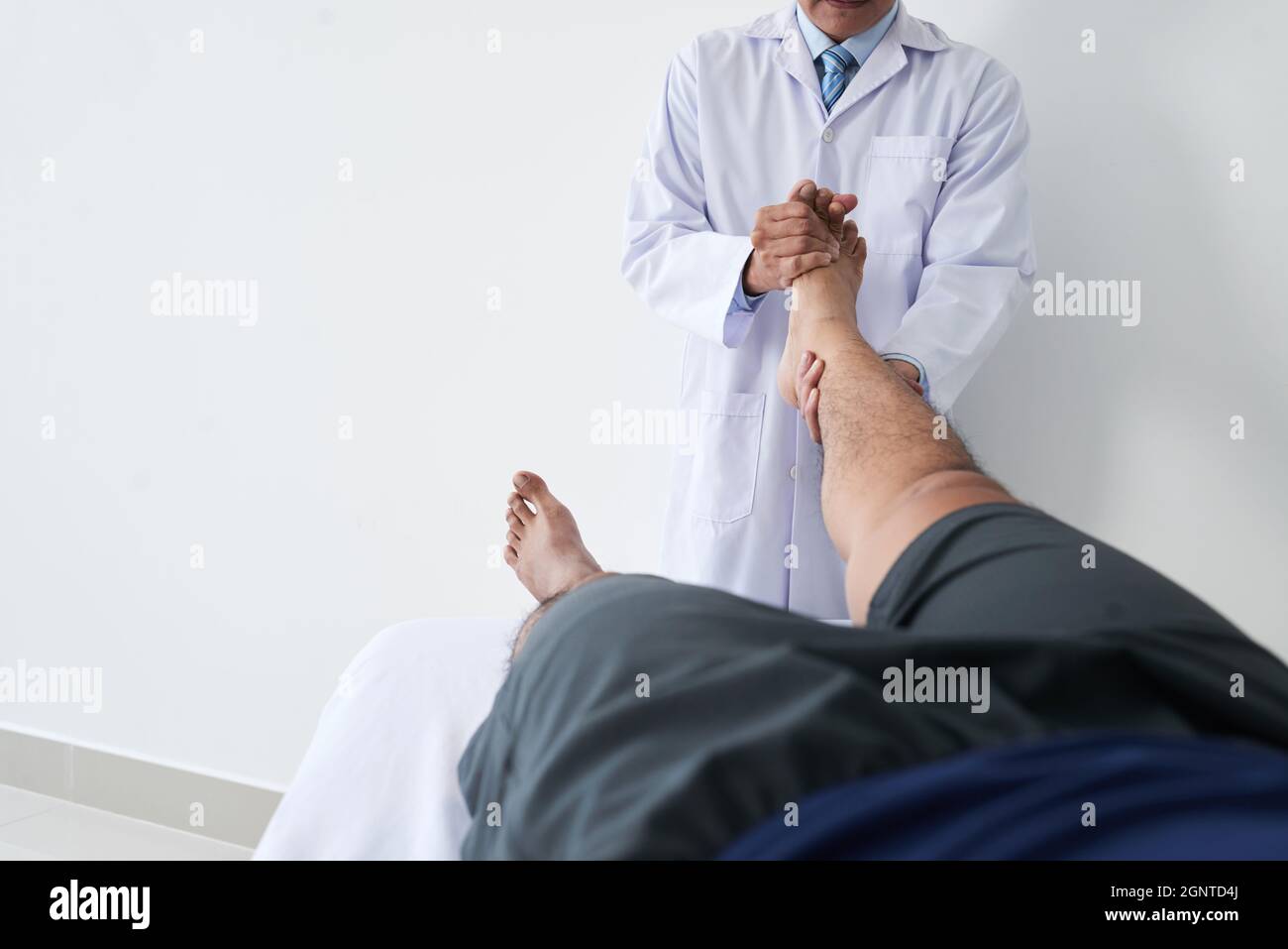 Horizontal shot of unrecognizable osteopathic physician working with ...