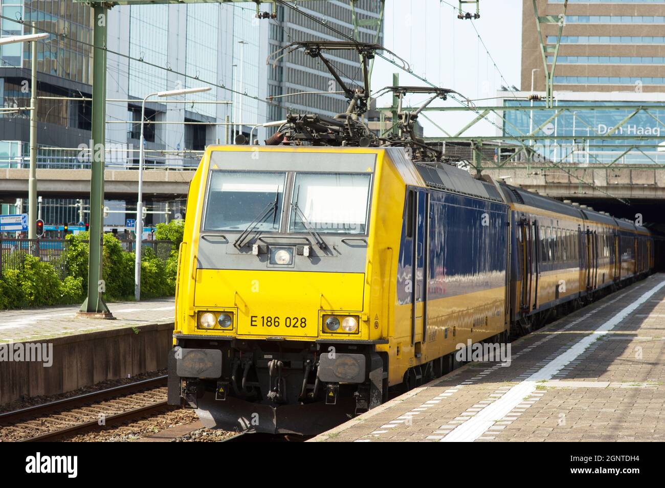 Big yellow powerful diesel locomotive for a passenger train at The ...