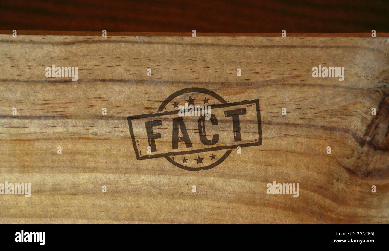 Fact stamp printed on wooden box. News, truth and real information ...