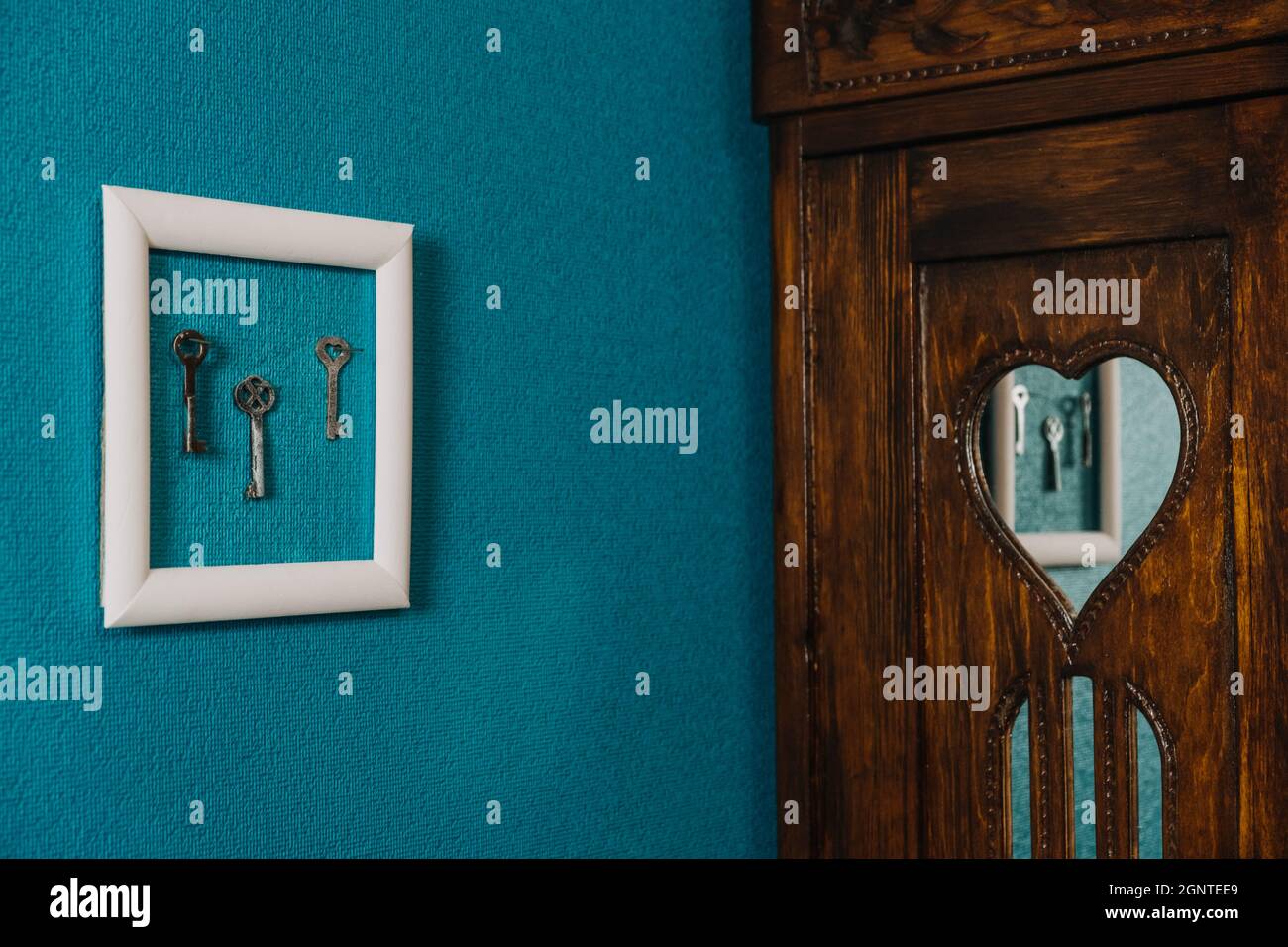 Key in frame on blue wall backgroung. Key new home, homeownership, keys ...