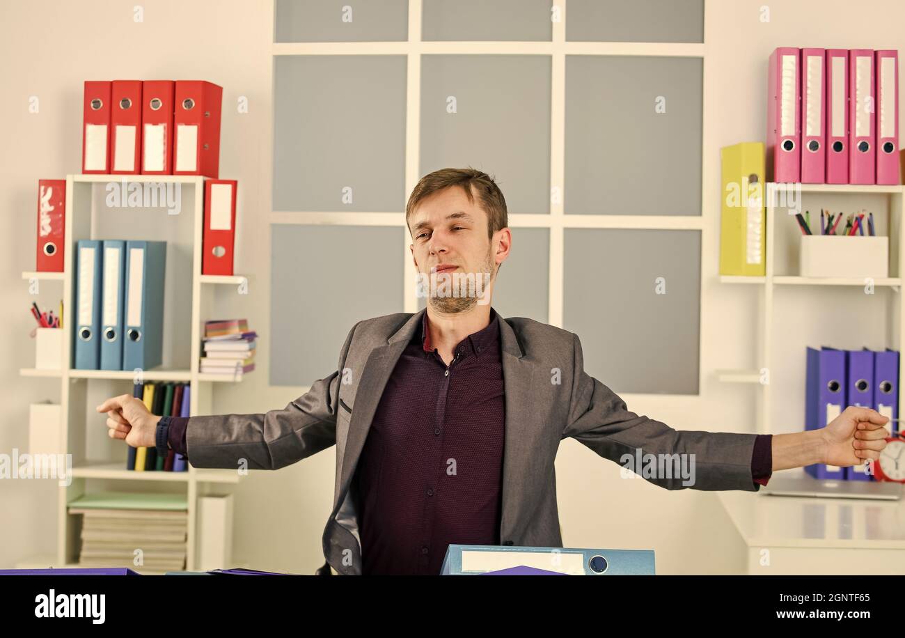 Man lawyer stretching muscles sit table exhaust with too much work ...