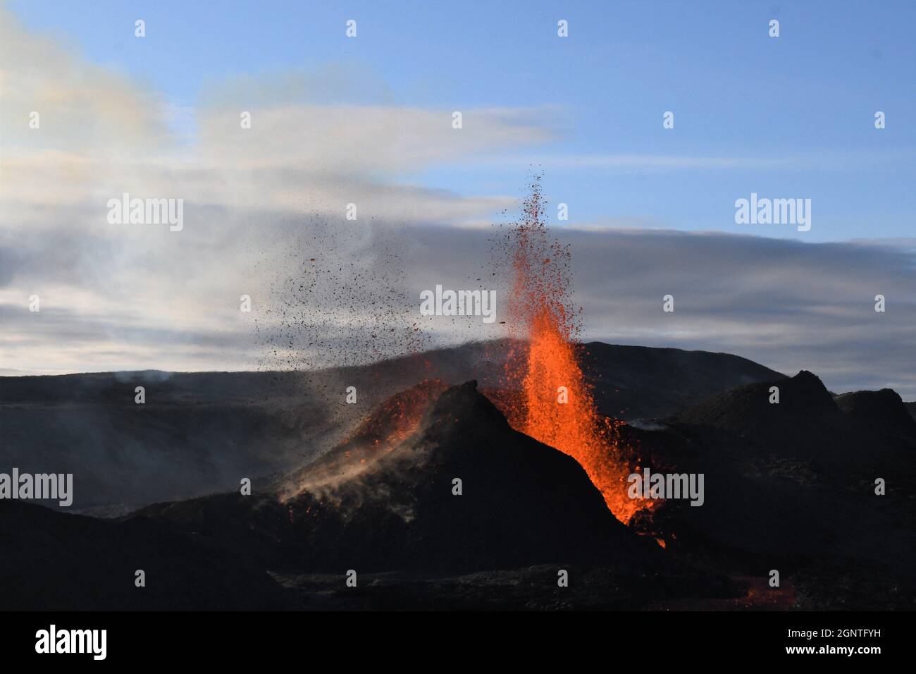 Volcanic vent at Fagradalsfjall, Iceland, erupting orange and red lava ...
