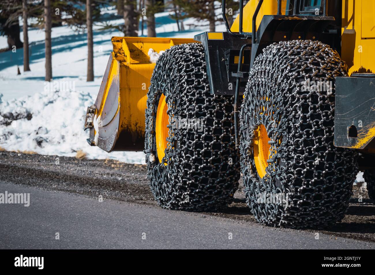 Chain on road maintenance machine Stock Photo - Alamy