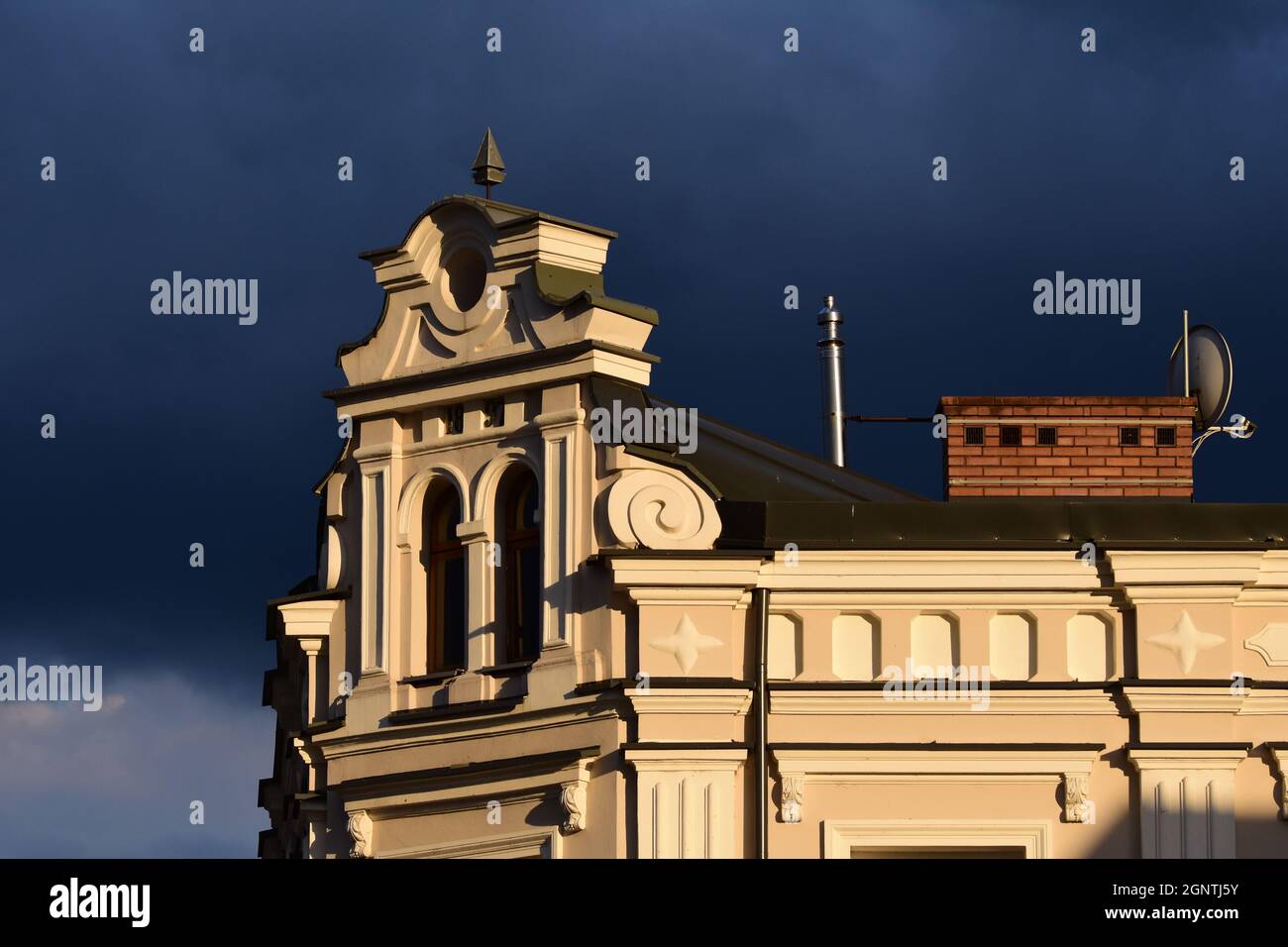 The front of the historic building against the backdrop of severe storm ...