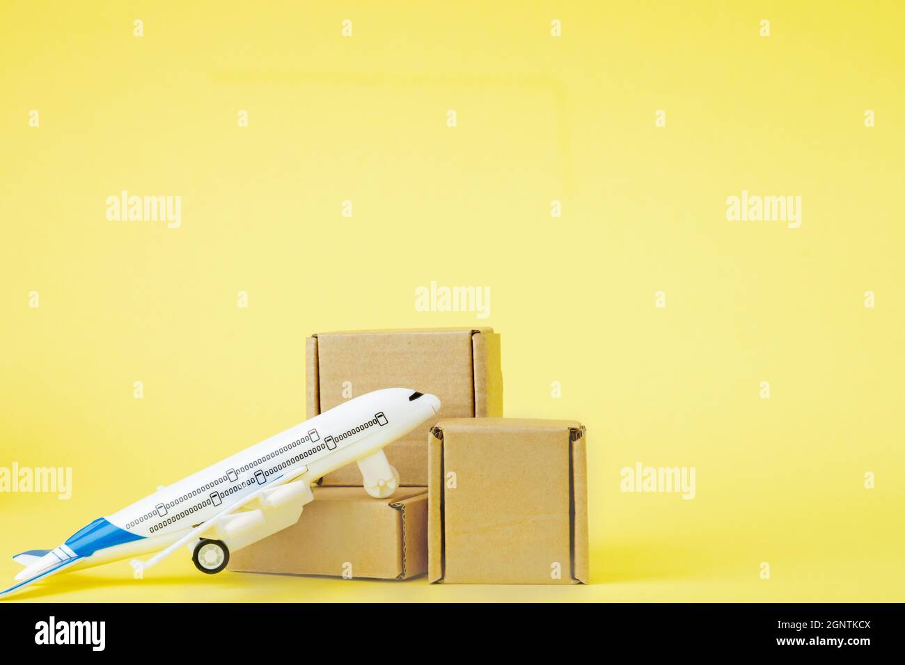 Airplane and stack of cardboard boxes. concept of air cargo and parcels ...
