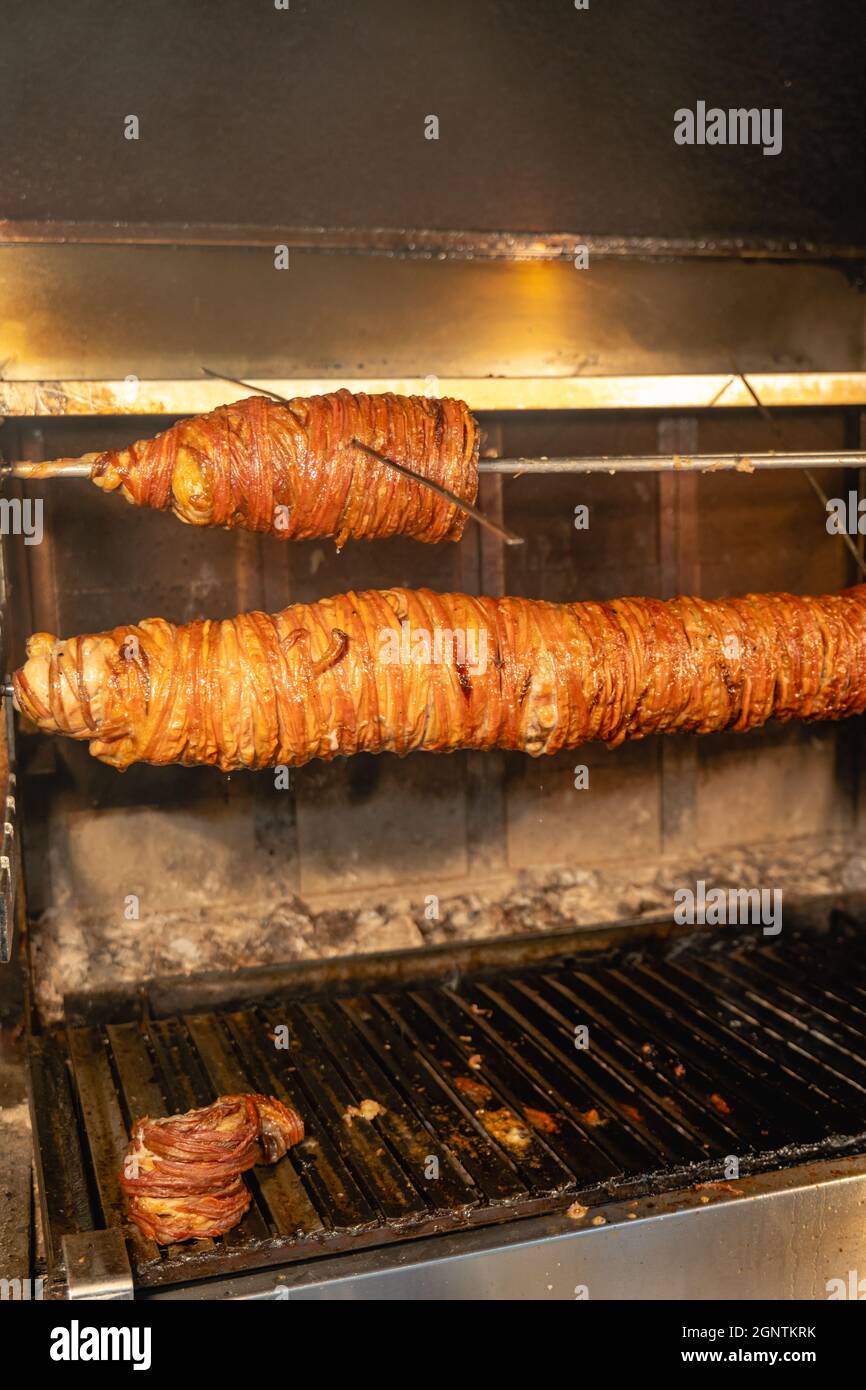 Kokoretsi (Kokoreç) roasted in the grill, Turkish traditional cuisine ...