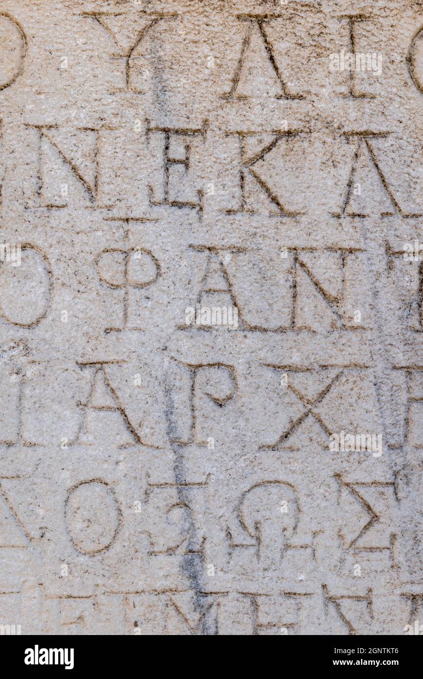 Ancient Greek inscriptions on stone in archeological ruin in ancient ...