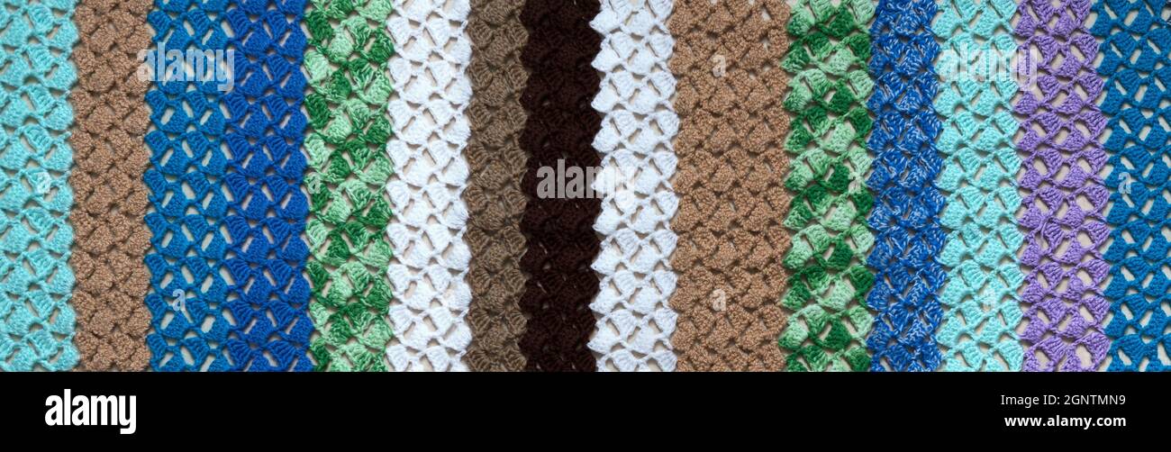 Knitted rug with a pattern of stripes. Simples of wool texture pattern ...