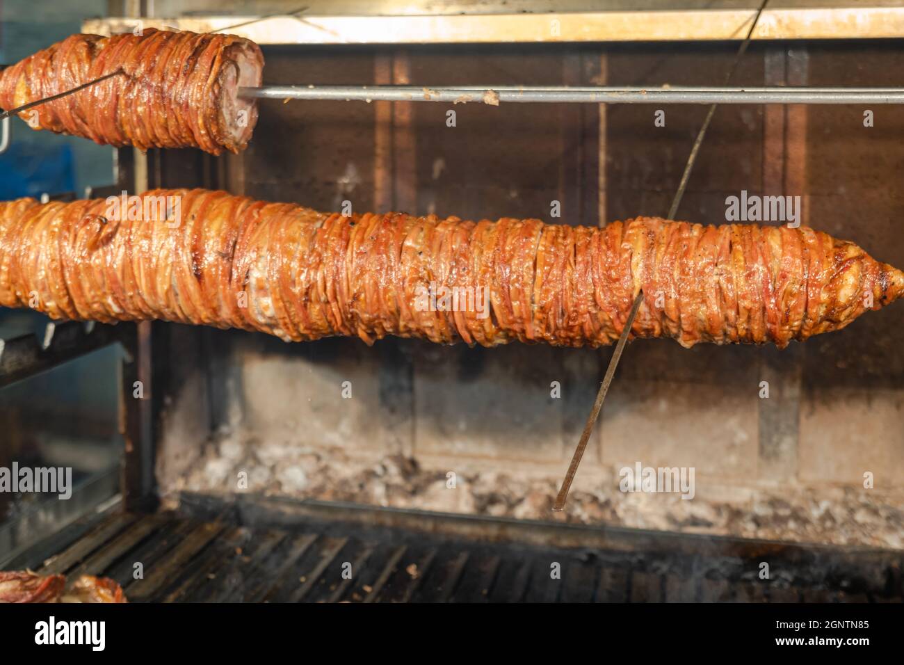 Kokoretsi (Kokoreç) roasted in the grill, Turkish traditional cuisine ...