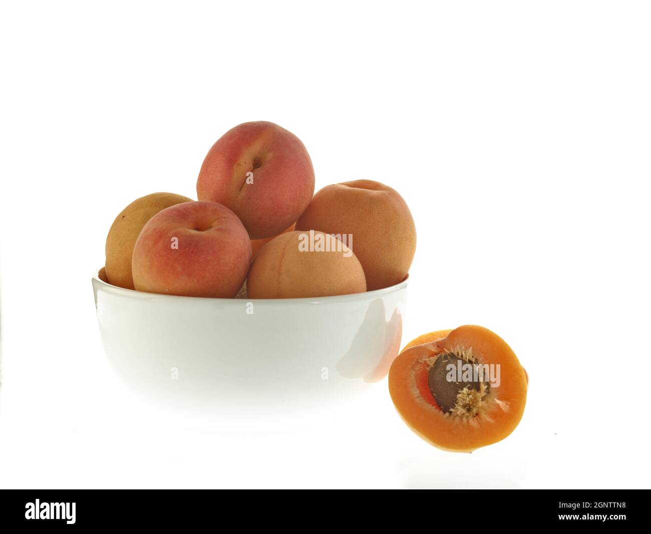Colourful and sweet Apricots still-life against plain white background ...