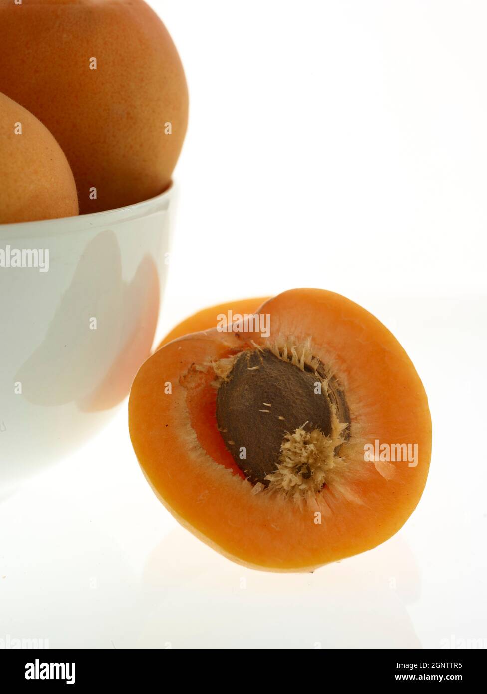 Colourful and sweet Apricots still-life against plain white background ...