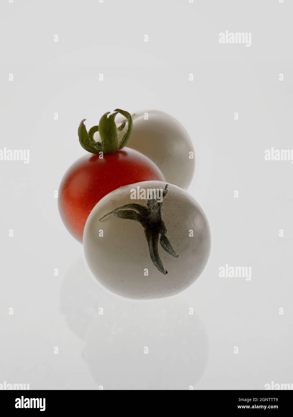 Bite sized tomato on white background, high resolution food ingredient ...
