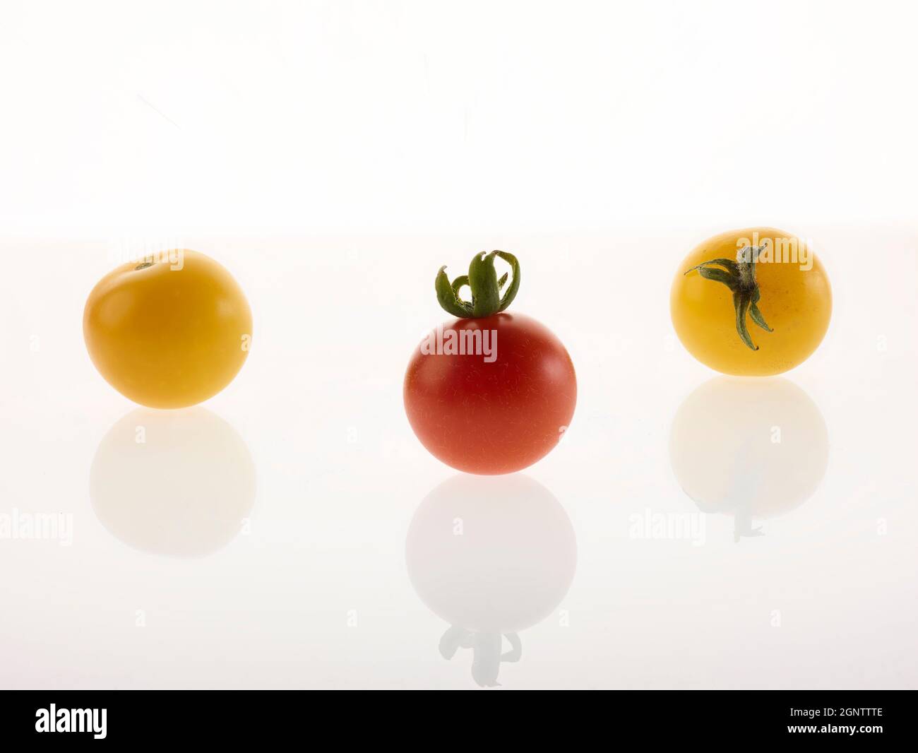 Bite sized tomato on white background, high resolution food ingredient ...