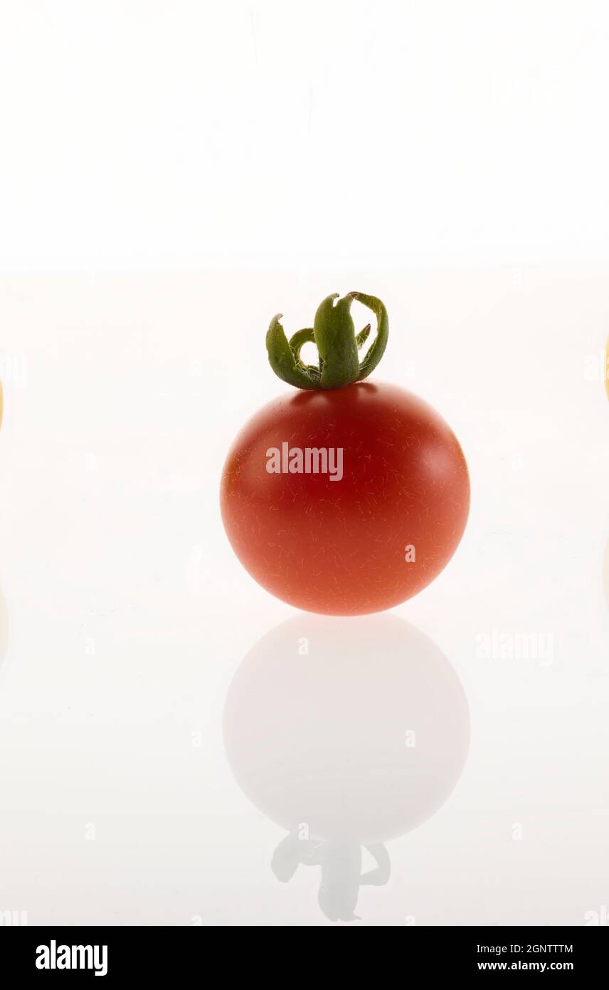 Bite sized tomato on white background, high resolution food ingredient ...