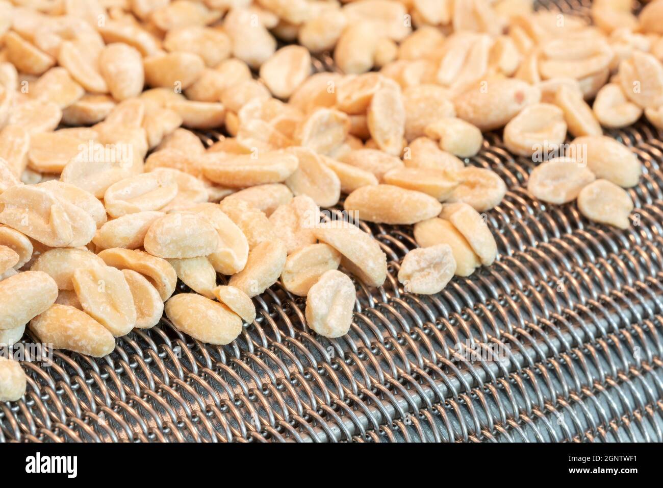 fried peanuts, Roasting and blanching peanuts. Process of peeling ...