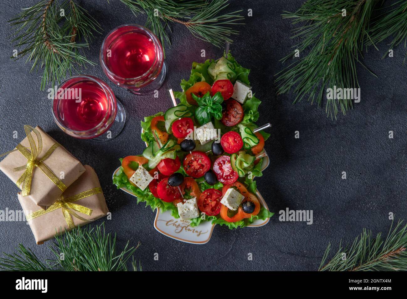 Festive canapes with cucumbers, tomatoes and cheese served in plate as ...