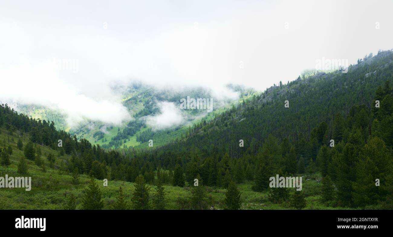 Descent from the pass into the mountain valley. The slopes of the ...