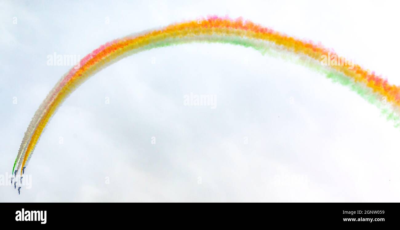 View of airplanes in the sky with rainbow smoke trails Stock Photo - Alamy