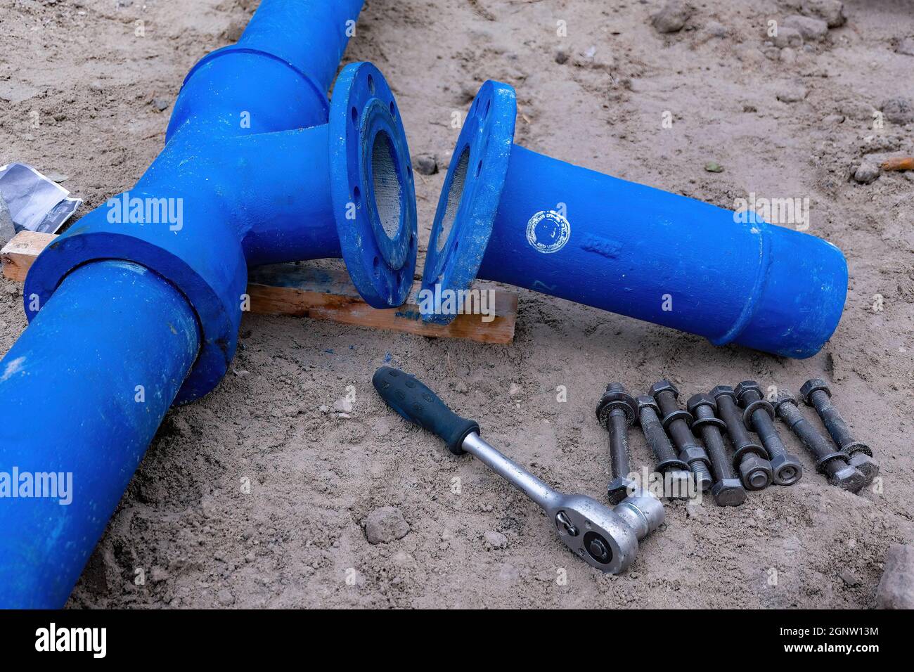 Cast metal pipe connection with flange and tools Stock Photo - Alamy