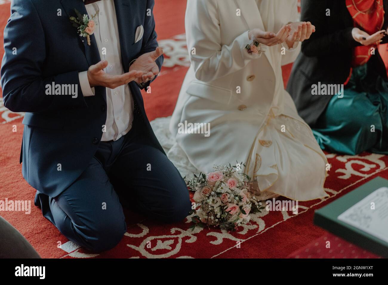 Bride and groom praying on their wedding day Stock Photo - Alamy