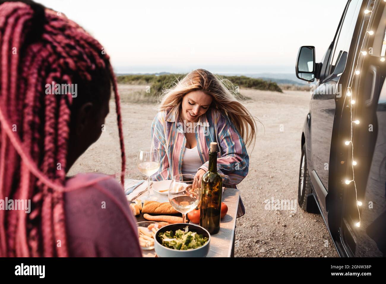 Multiracial Young Friends Having Fun Doing Healthy Dinner With Mini