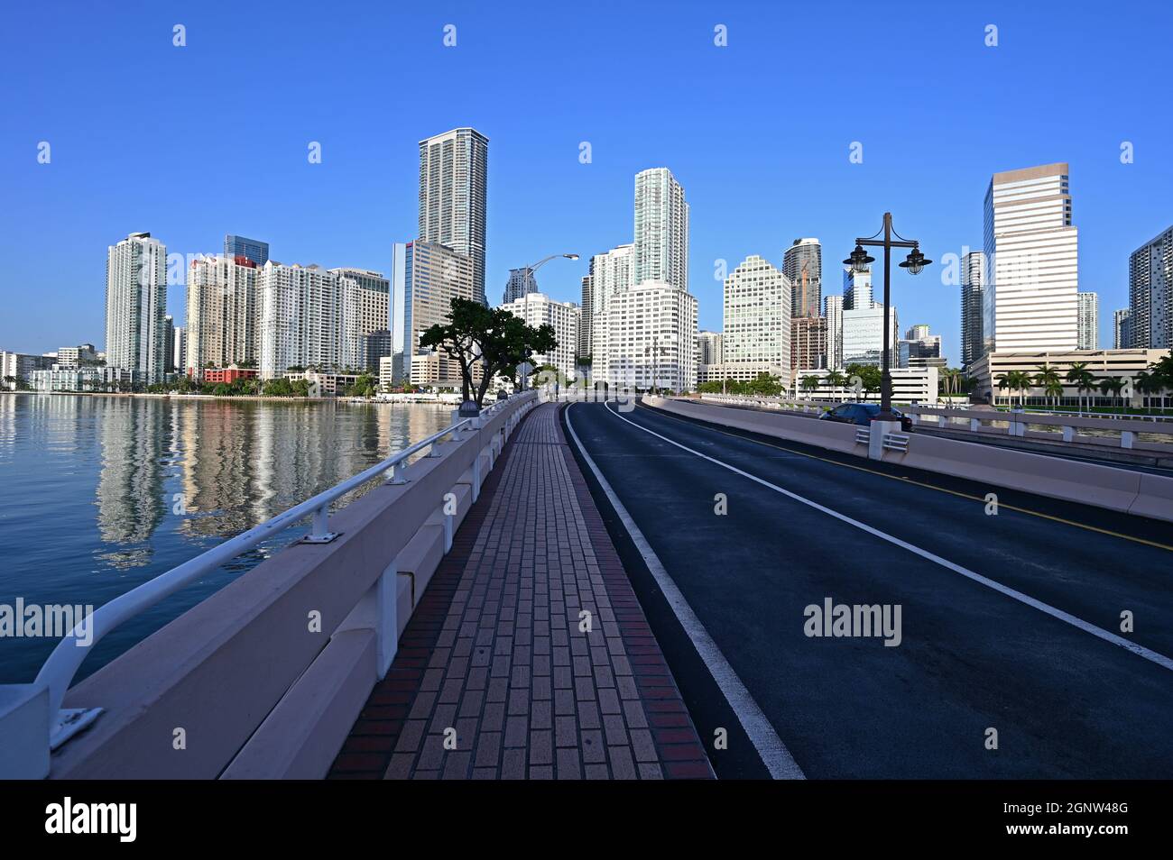 Brickell Key Bridge and City of Miami skyline at sunrise under clear ...