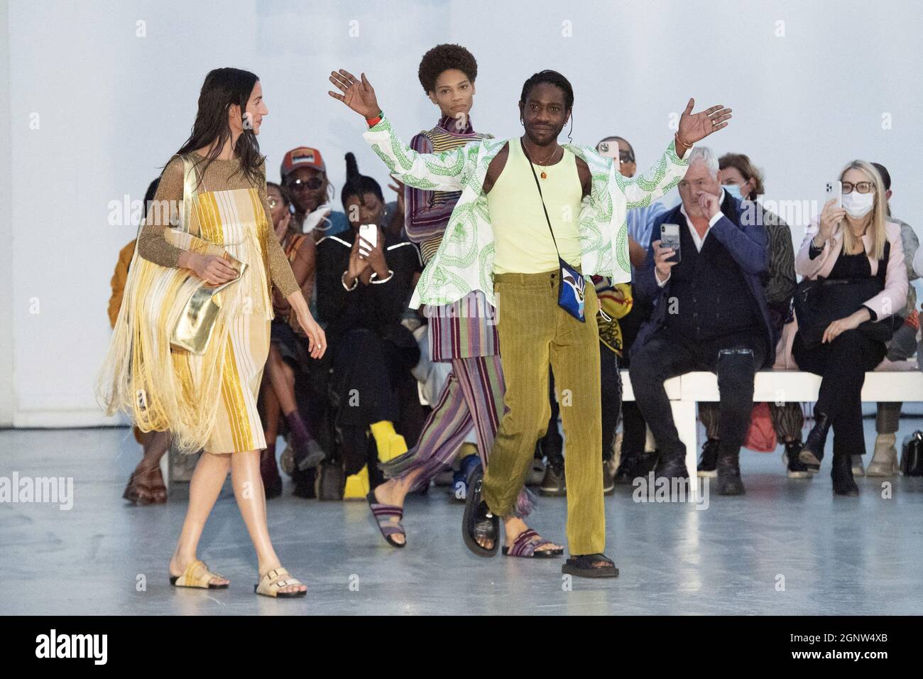 Designer Kenneth Ize makes an appearance on the runway during the ...