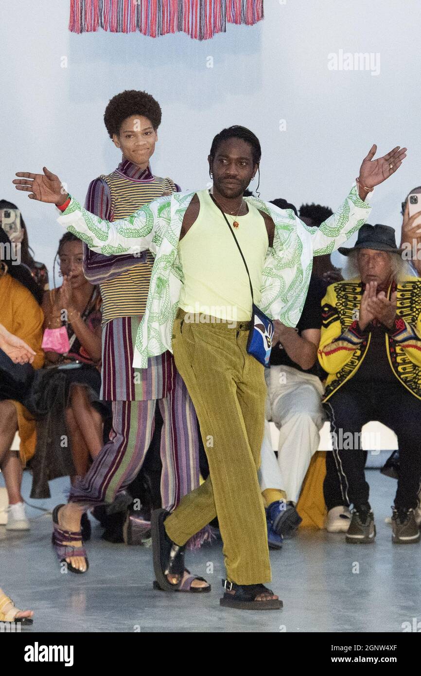 Designer Kenneth Ize makes an appearance on the runway during the ...