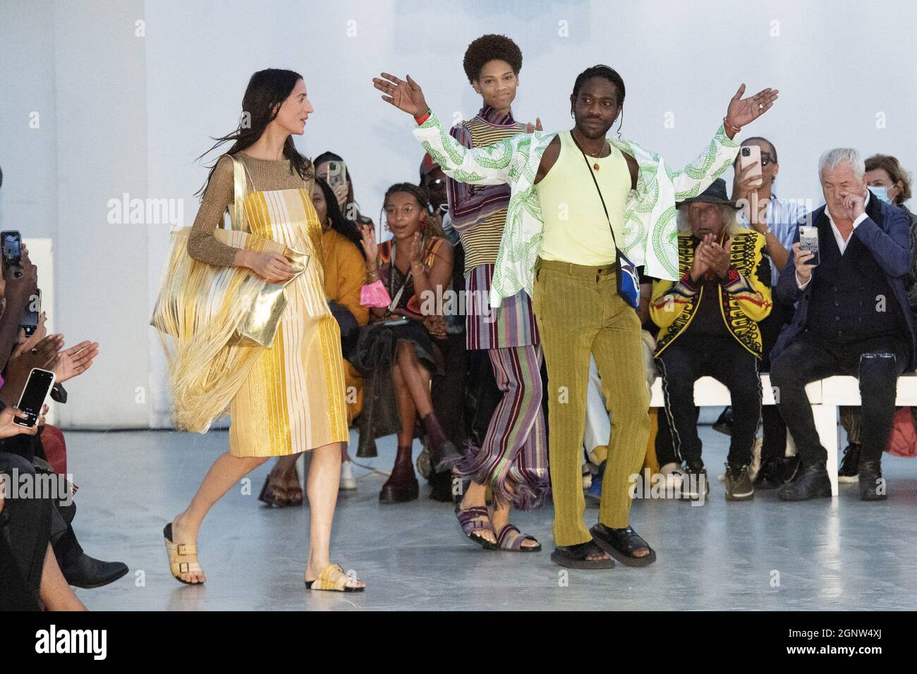 Designer Kenneth Ize makes an appearance on the runway during the ...