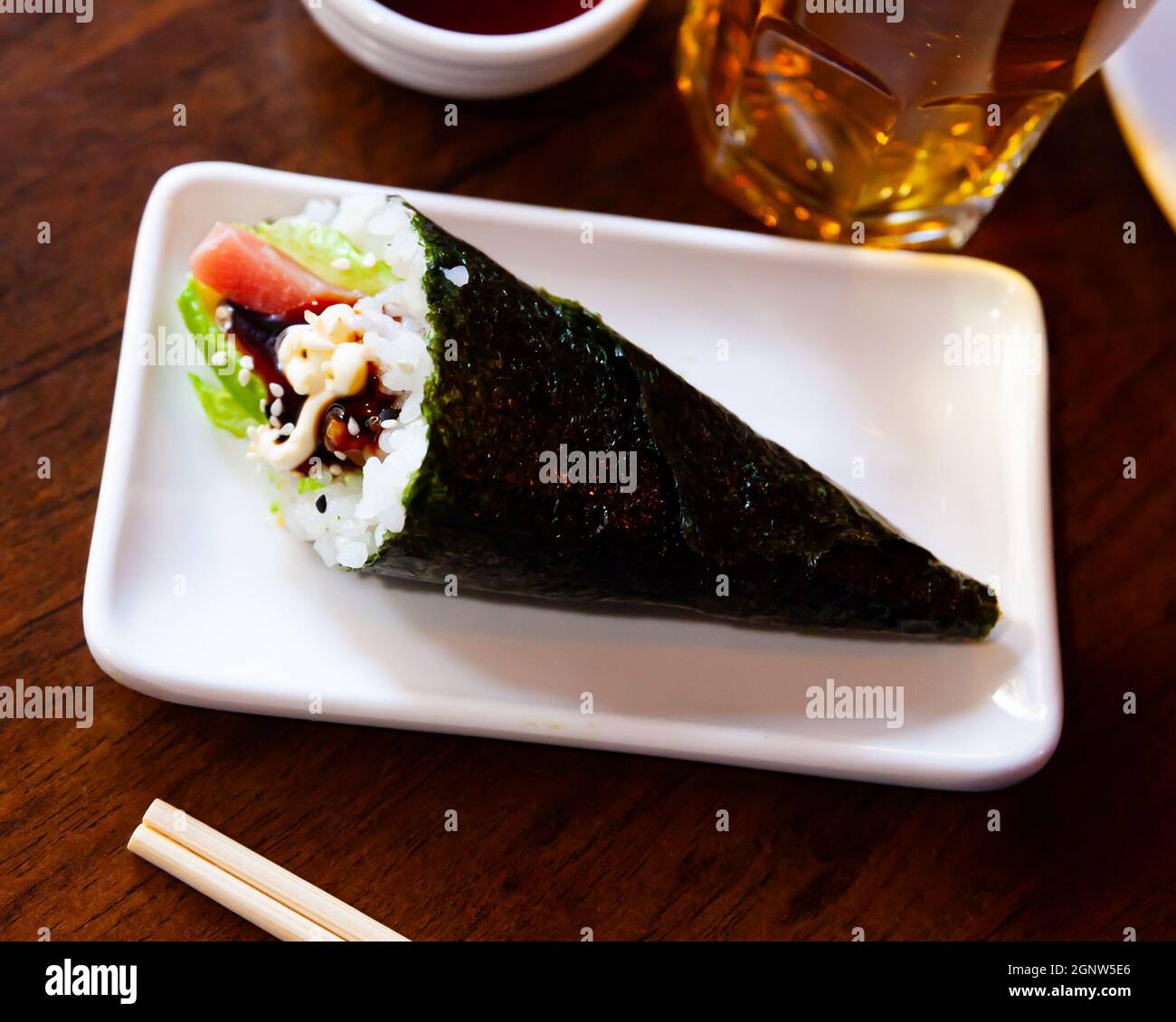 Temaki sushi with tuna and avocado Stock Photo - Alamy