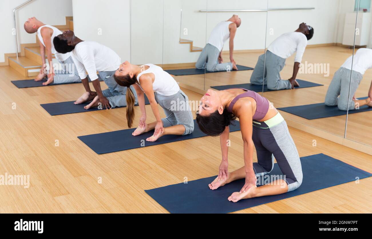 Young women in yoga poses hi-res stock photography and images - Alamy