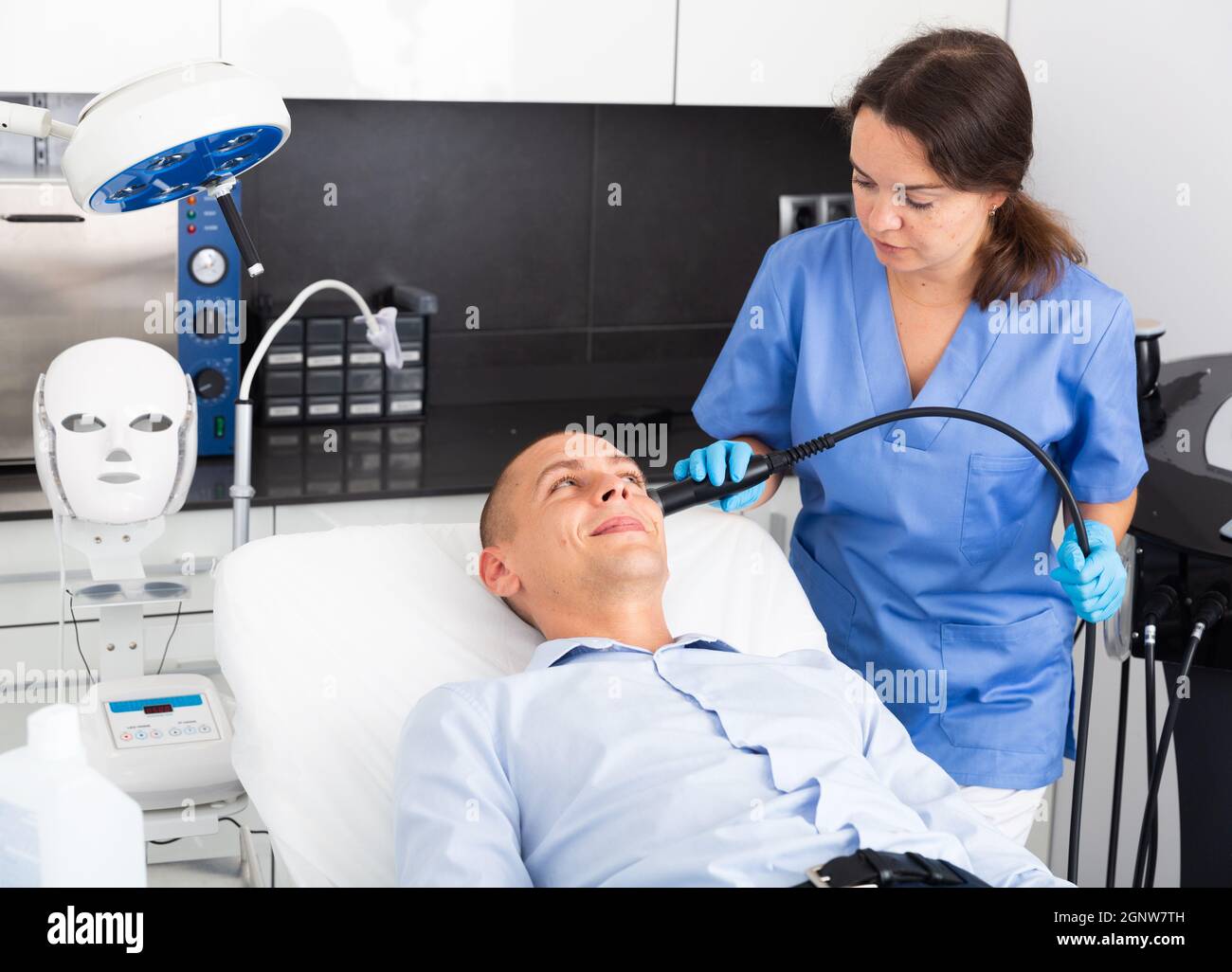 Man getting face ultrasound lifting procedure Stock Photo - Alamy