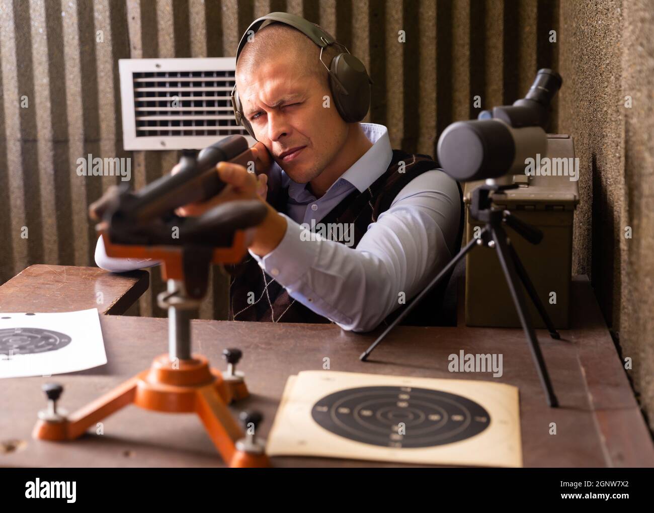 Man shoots semi-automatic rifle at shooting range Stock Photo - Alamy