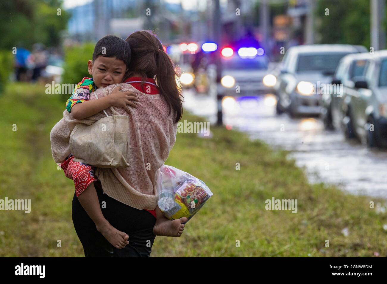 Thailand. 27th Sep, 2021. A boy is seen crying during the evacuation ...
