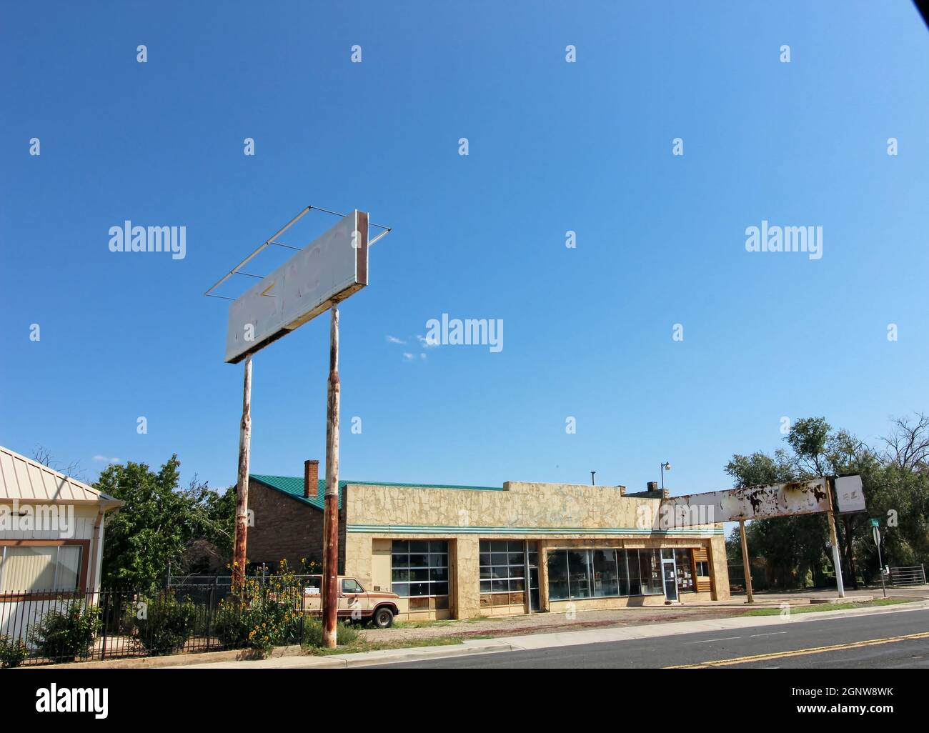 Old Abandoned Commercial Store Front With Rusty Sign Posts Stock Photo ...