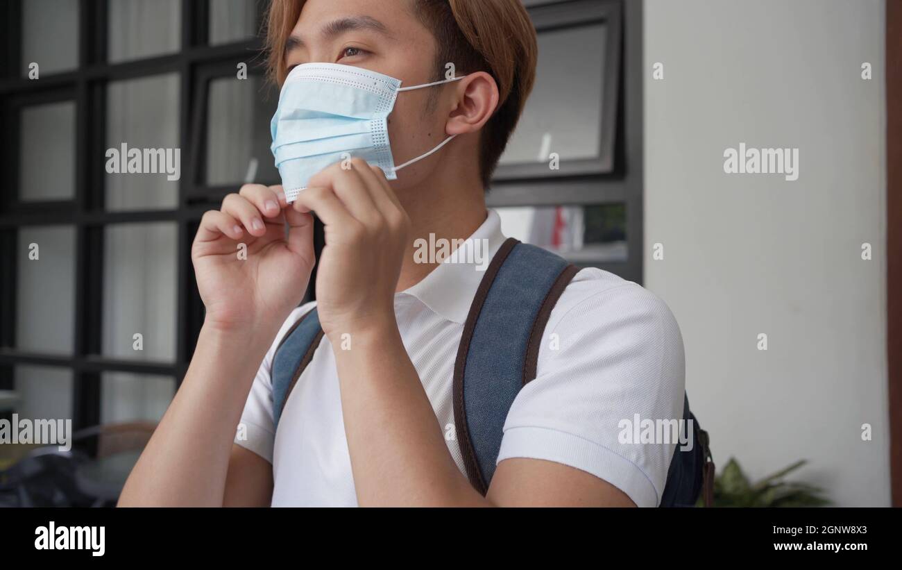 student wearing face mask before going to school or campus Stock Photo ...