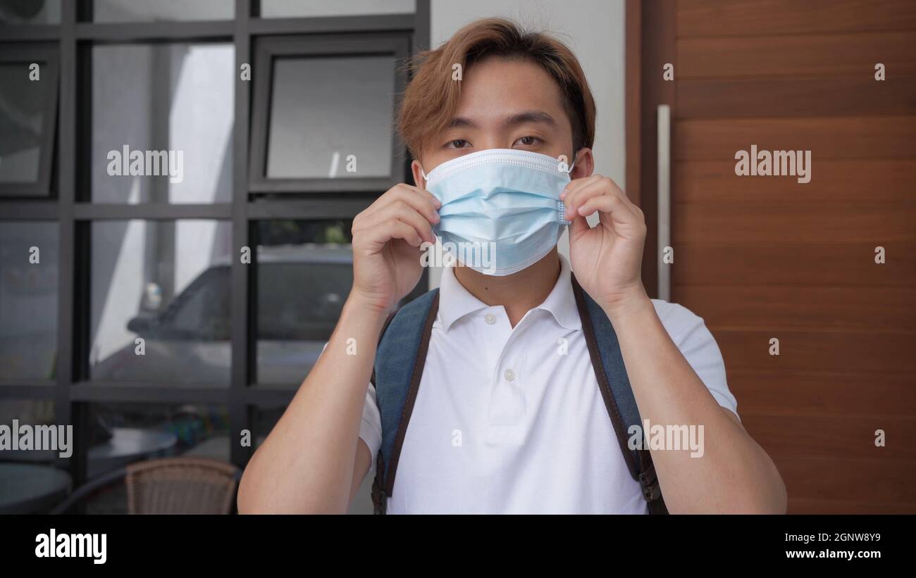 student wearing face mask before going to school or campus Stock Photo ...