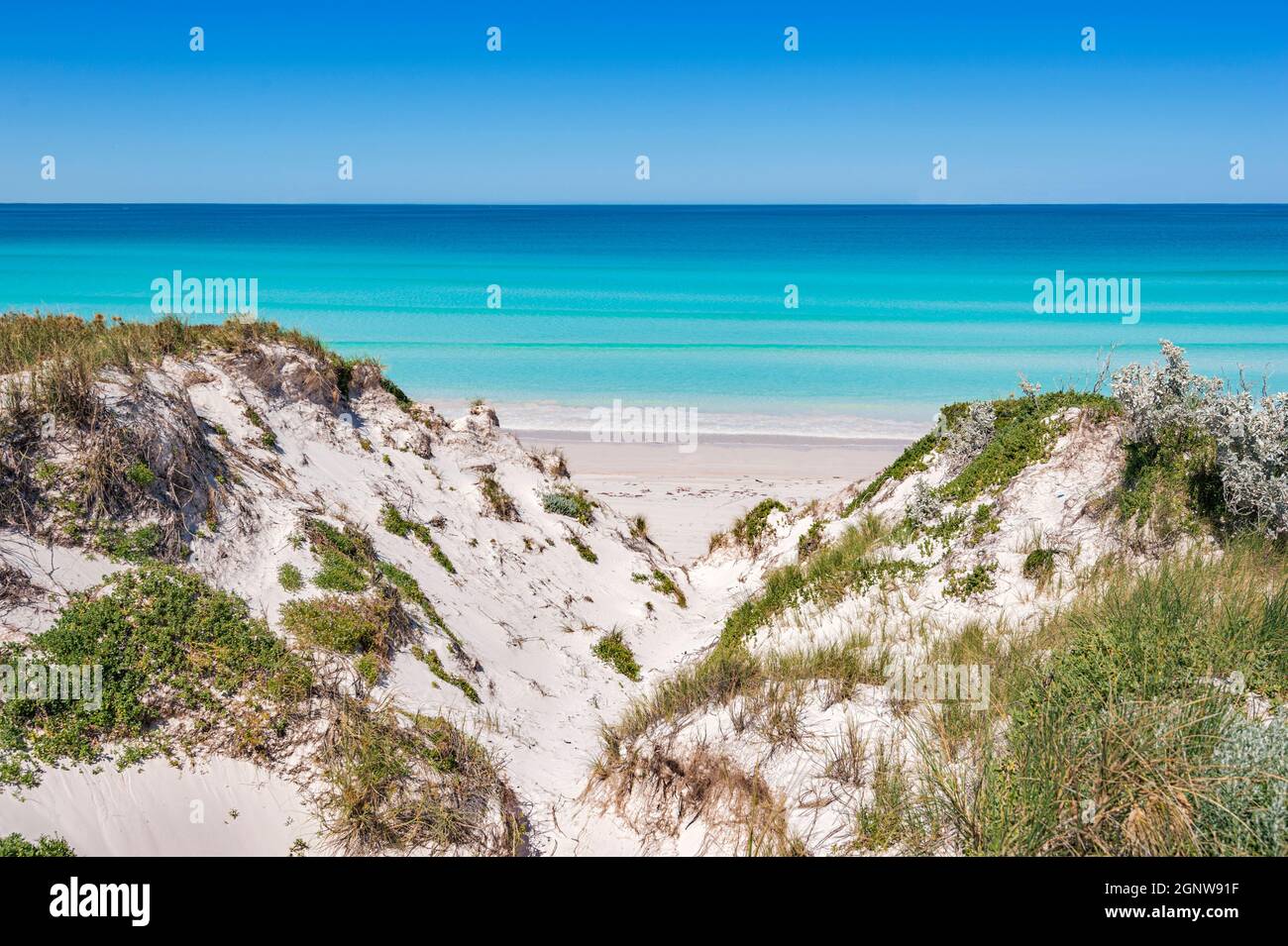 Spectacular view of white sand dunes and turquoise waters of the Indian ...